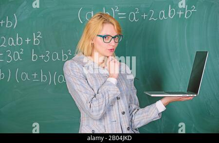 Digital technologies concept. Educator smart lady with modern laptop ...