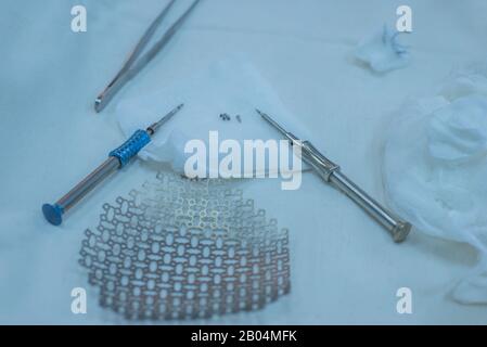 Skull clamp with pins and antiseptic solution for head fixation in ...