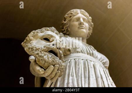 Statue of Melpomene, the muse of tragedy holding a tragic mask, on ...