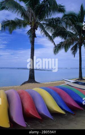 COOK ISLANDS, RAROTONGA, COLORFUL BOATS ON BEACH, COCONUT PALM TREES ...