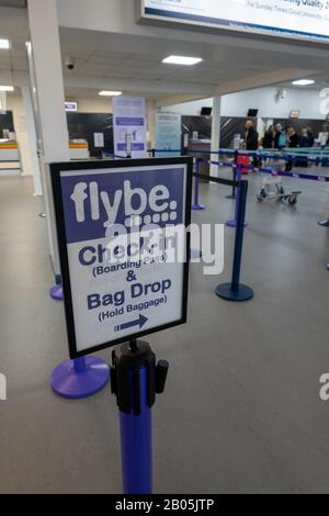 Flybe Check-in and bag drop line, Exeter Airport Stock Photo - Alamy