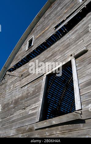 Window of an old, falling apart barn Stock Photo - Alamy