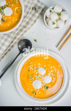 Hobak juk, korean traditional pumpkin porridge soup, with rice balls ...