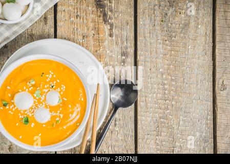 Hobak juk, korean traditional pumpkin porridge soup, with rice balls ...