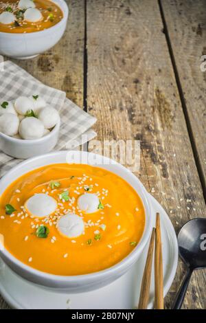 Hobak juk, korean traditional pumpkin porridge soup, with rice balls ...