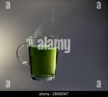 Morning tea cup with vapor on the black textured background Stock Photo ...
