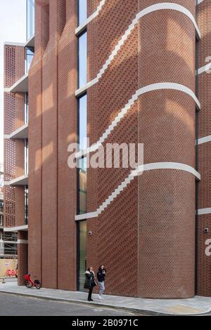 Wide view of curved brick corner. UCLH Eye Hospital, London, United ...