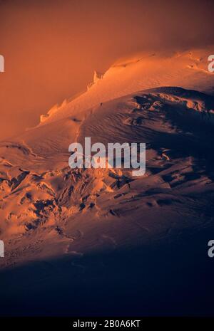 ANTARCTIC PENINSULA AREA, MIDNIGHT SUNLIGHT ON GLACIER COVERED MOUNTAIN ...