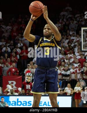 Michigan guard Zavier Simpson takes the inbound pass during the first ...