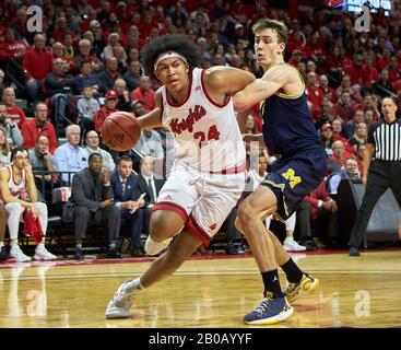 Michigan guard Franz Wagner (21) and guard Eli Brooks (55) celebrate in ...
