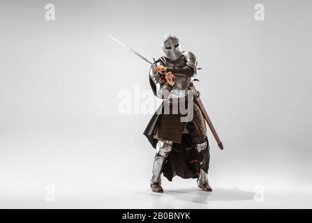 Brave armored knight with professional weapon fighting isolated on ...