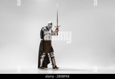 Brave armored knight with professional weapon fighting isolated on ...