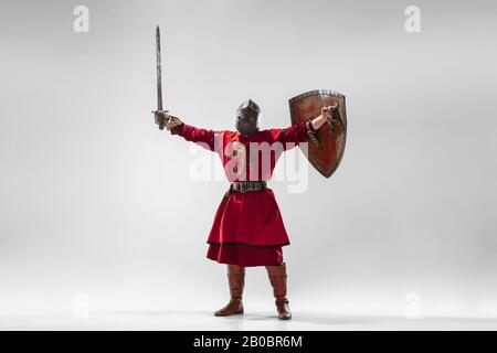 Brave armored knight with professional weapon fighting isolated on ...
