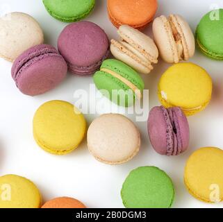 round baked multi-colored almond flour cakes macarons, dessert isolated ...
