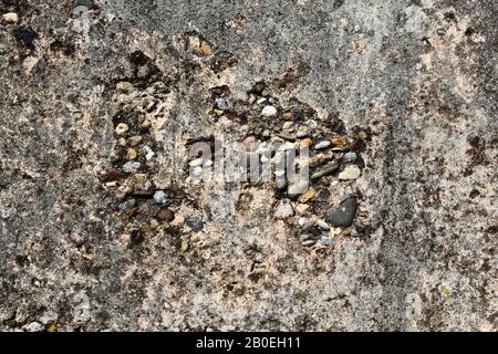 The picture shows a background with a greystone wall Stock Photo - Alamy