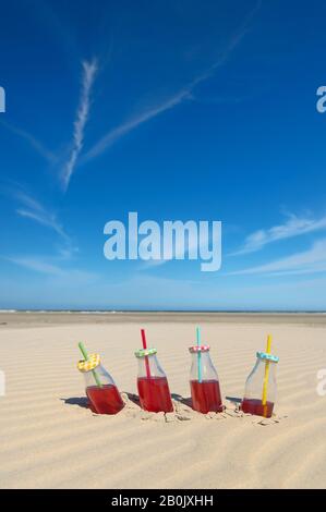Bottles lemonade at the empty beach Stock Photo - Alamy