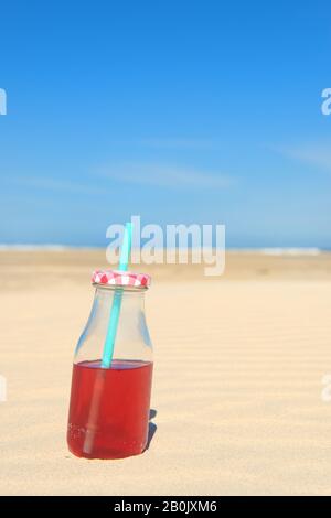 Bottles lemonade at the empty beach Stock Photo - Alamy