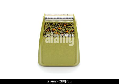Vintage Philips green electric shaver, isolated on white background ...