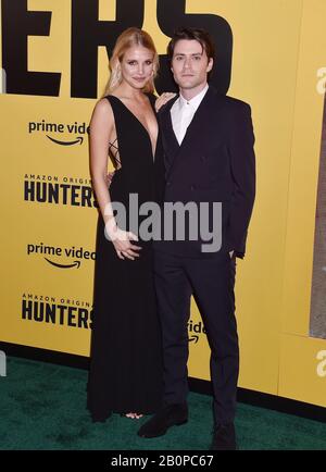 People attend an event where Amazon on Wednesday, Feb. 26, 2025 ...