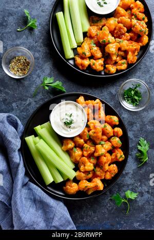 Cauliflower wings food. Pieces of cauliflower cooked in batter. Meat ...