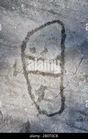 Petroglyph, rock carving, of two feet outlines. Carved by the ancient ...