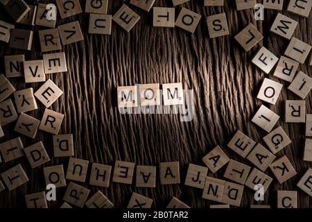 MOM wooden tile font concept Stock Photo - Alamy
