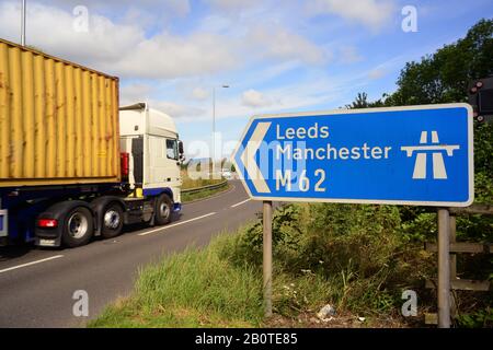 traffic passing m62 motorway sign to leeds and manchester at normanton ...