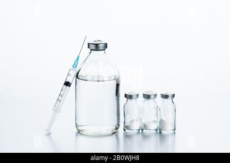 Vaccination kit. Antibiotics in glass bottles, saline solution for drug ...