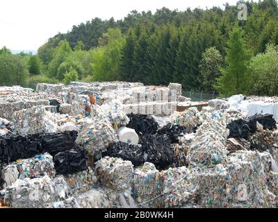Litter piled up on top of commercial waste collection rubbish and ...