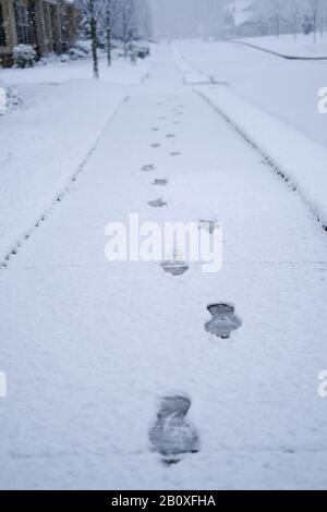 Steps in the snow Stock Photo - Alamy
