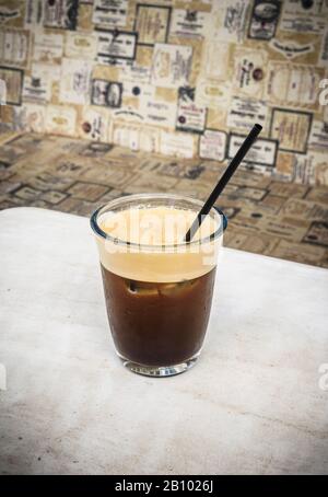 Greek Freddo Espresso coffee on a table in Greece Stock Photo - Alamy