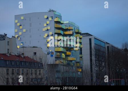 Strange glass building facade in green yellow in Paris Stock Photo - Alamy