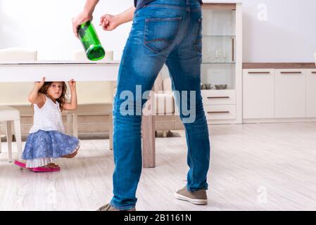 The drunk father in domestic child abuse and violence concept Stock ...