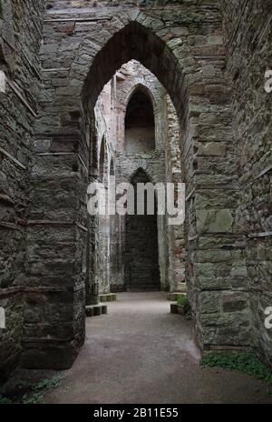 Stone arched door inside the walls of the medieval military fort which ...
