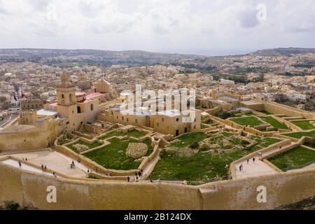 Aerial drone photo - The Gozo Citadel at sunset. A medieval fortress in ...
