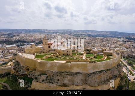 Aerial drone photo - The Gozo Citadel at sunset. A medieval fortress in ...
