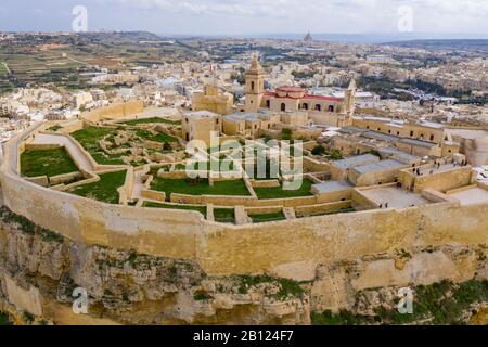 Aerial drone photo - The Gozo Citadel at sunset. A medieval fortress in ...