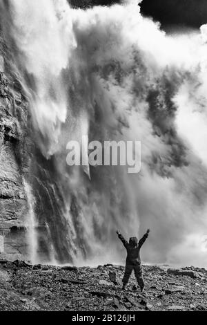 Hiker in front of Emperor Falls along the Robson River in Mount Robson ...