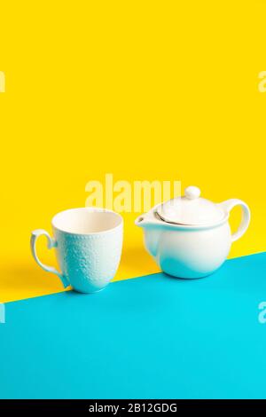 Blue and white cup pot with black coffee americano on wooden table in ...