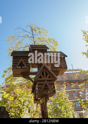 Small birdhouse standing on a tree trunk in the countryside Stock Photo ...