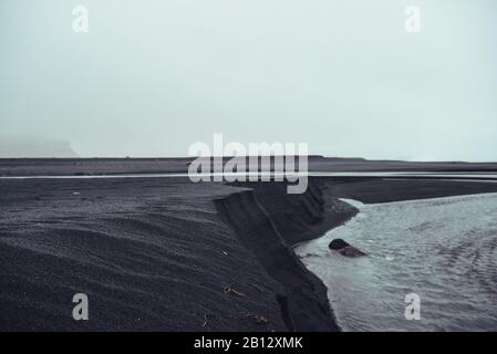 Small black sand cliffs on the south coast of Iceland at Solheimasandur ...