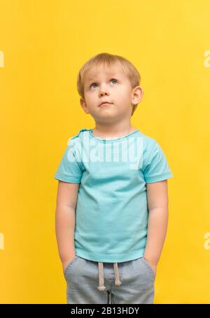 Beautiful blond child, toddler boy, painting easter eggs with mother at ...