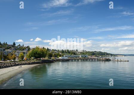Small quiet beach tucked along Ruston Way in Tacoma on a calm summer ...