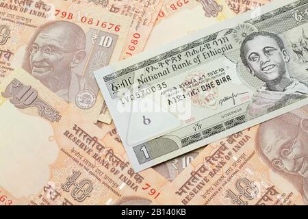 ten Ethiopian birr bank note and magnifying glass isolated on white ...