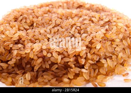Close up Rice devzira Red with white background Stock Photo - Alamy
