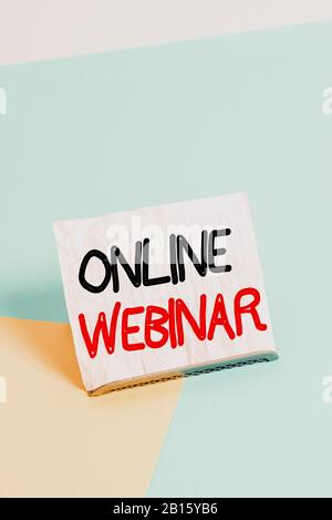 Webinar concept on a paper held by a hand Stock Photo - Alamy