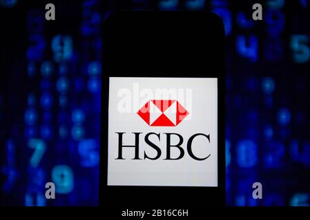 In this photo illustration, a HSBC Bank logo seen displayed on a ...