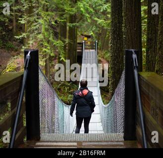 Walking the suspension bridge, Cascade Falls Regional Park in Mission ...