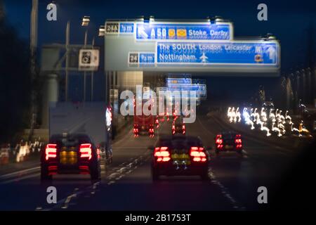 Motorway traffic and signs at night, at Junction 23A on the M1, Castle ...