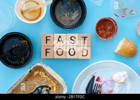 Leftover food on a tray, coffee cup, KFC bucket KFC waste Stock Photo ...